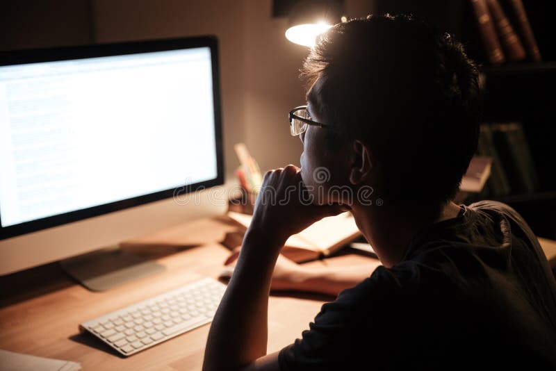 Thoughtful Man Working with Blank Screen Computer in Dark Room Stock ...