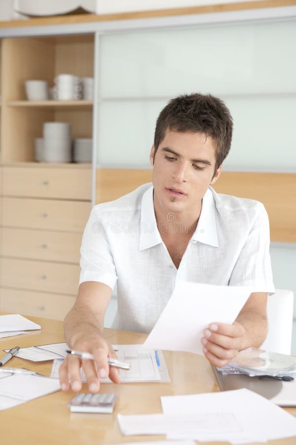 Thoughtful Man Working on Finances Stock Image - Image of folders ...