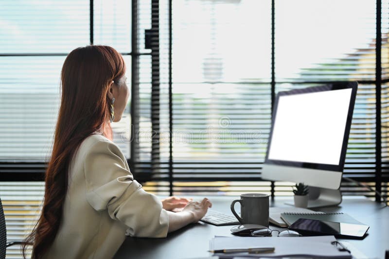 Thoughtful Millennial Businesswoman Sitting in Bright Modern Office and ...