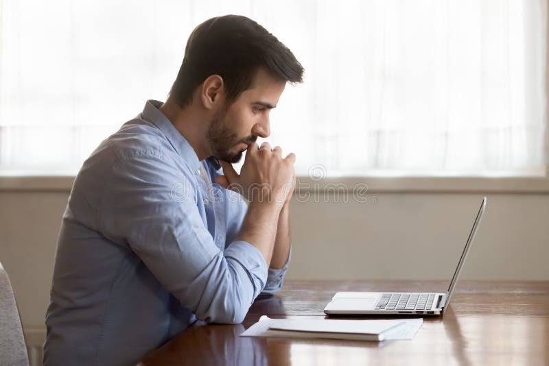 Thoughtful Nervous Man Looking at Laptop Screen, Making Decision Stock ...