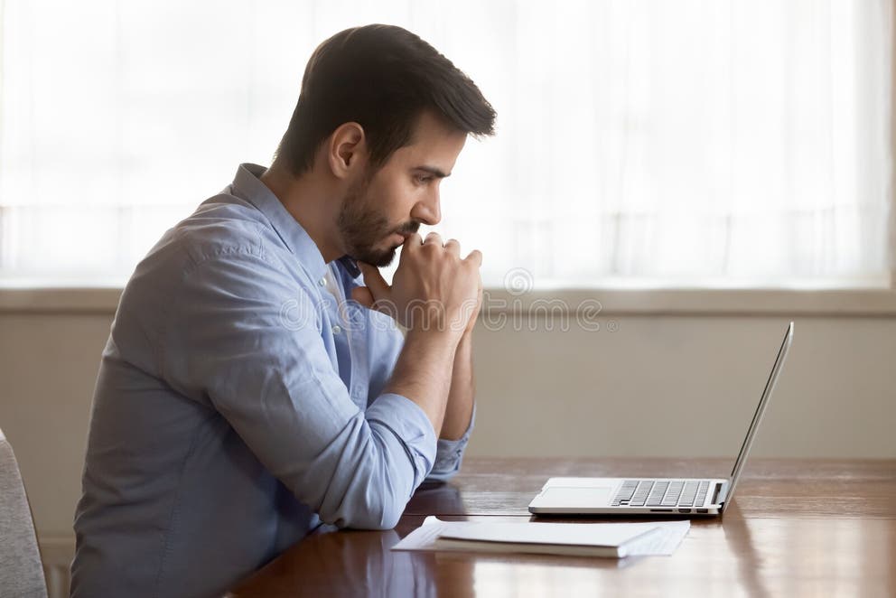 Thoughtful Nervous Man Looking at Laptop Screen, Making Decision Stock ...
