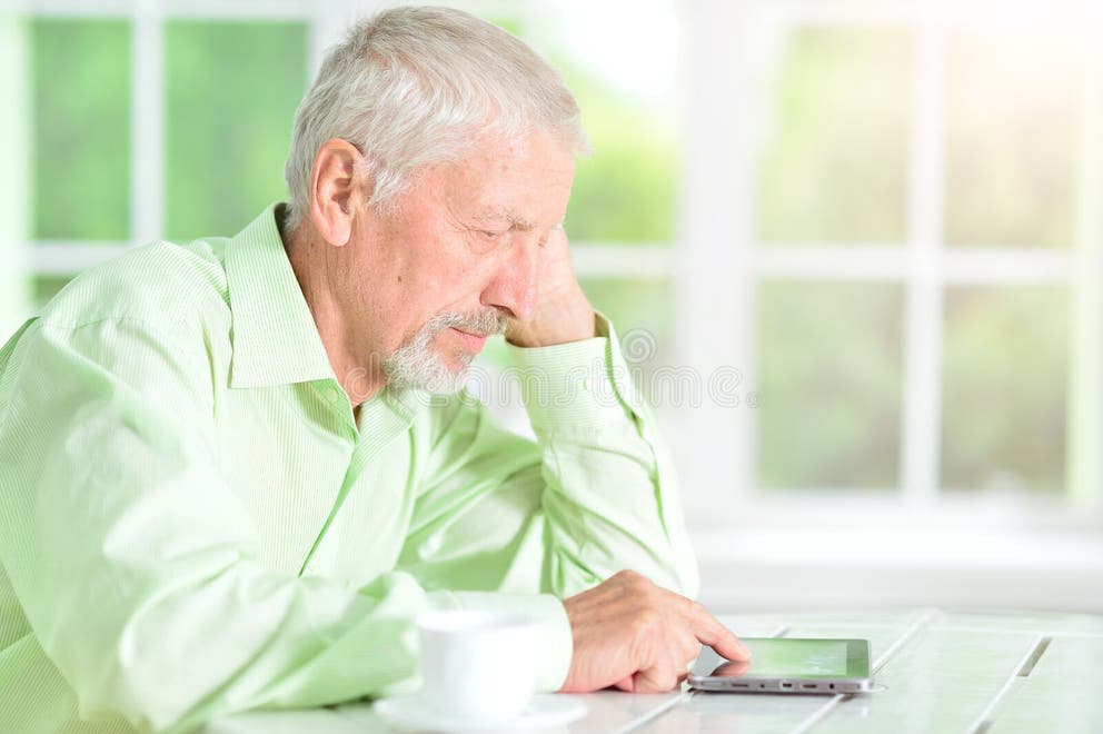 Thoughtful Old Man with Tablet at Home Stock Photo - Image of home ...