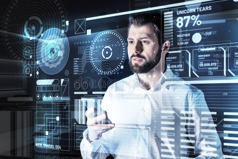 Thoughtful Programmer Looking at the Screen while Holding a Smartphone ...