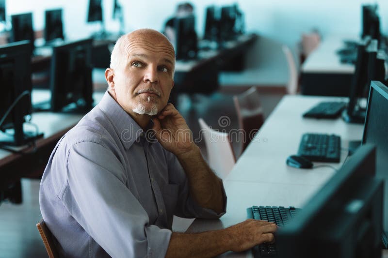 Thoughtful Programmer Working on Computer in Office Stock Image - Image ... Thoughtful Programmer Working on Computer in Office Stock Image - Image ...