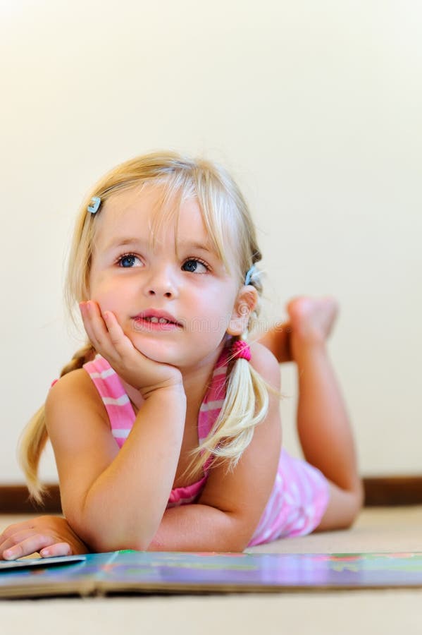 Thoughtful reader girl stock photo. Image of preschool - 18402296