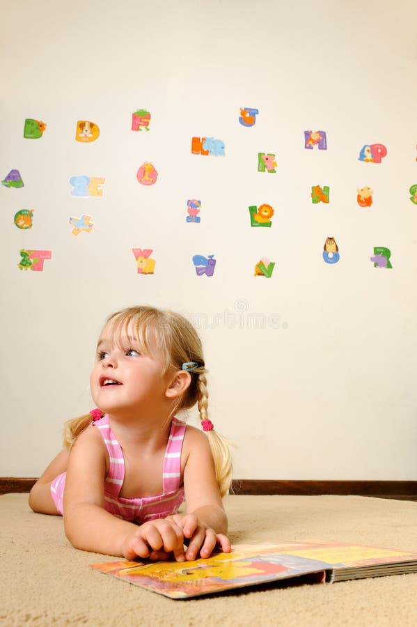Thoughtful reader girl stock image. Image of kindergarten - 18402401