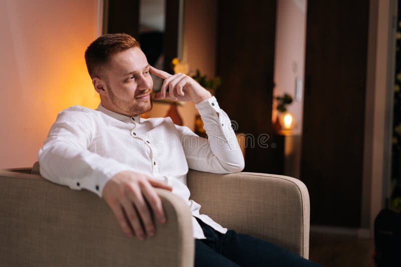 Thoughtful Relaxed Young Man Student Writer Sitting in Soft Armchair I ... Thoughtful Relaxed Young Man Student Writer Sitting in Soft Armchair I ...