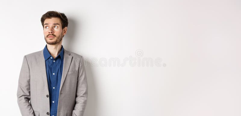 Thoughtful Sad Businessman in Suit Looking at Upper Left Corner Logo ...