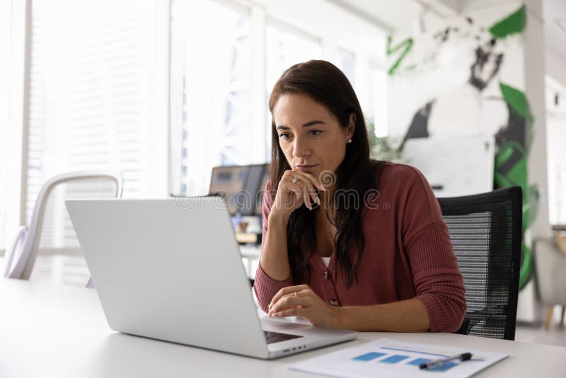 Thoughtful Serious Business Project Manager Working at Laptop Stock ...