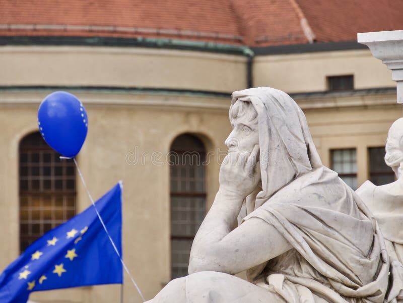 Thoughtful Statue and EU Symbols Stock Photo - Image of statue ...