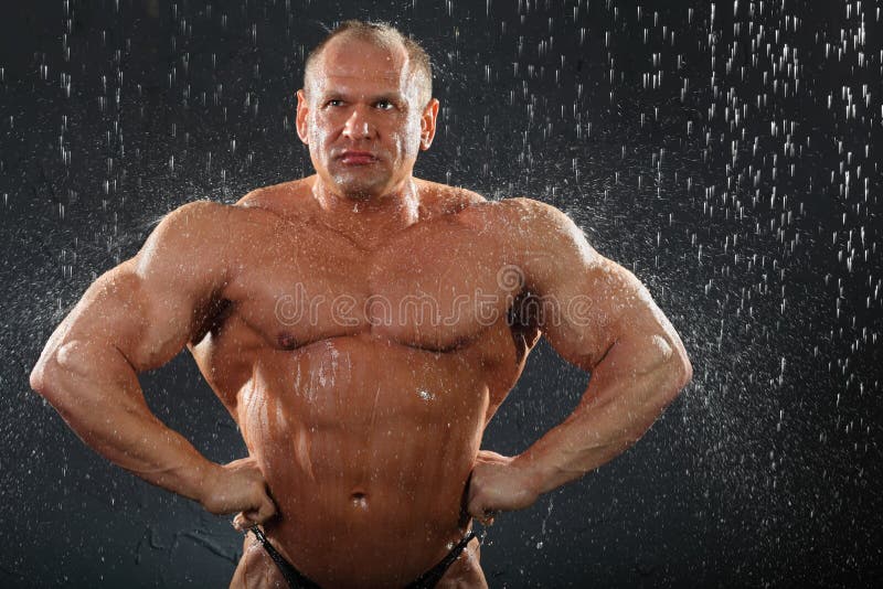 Thoughtful Undressed Bodybuilder Stands in Rain Stock Photo - Image of ...