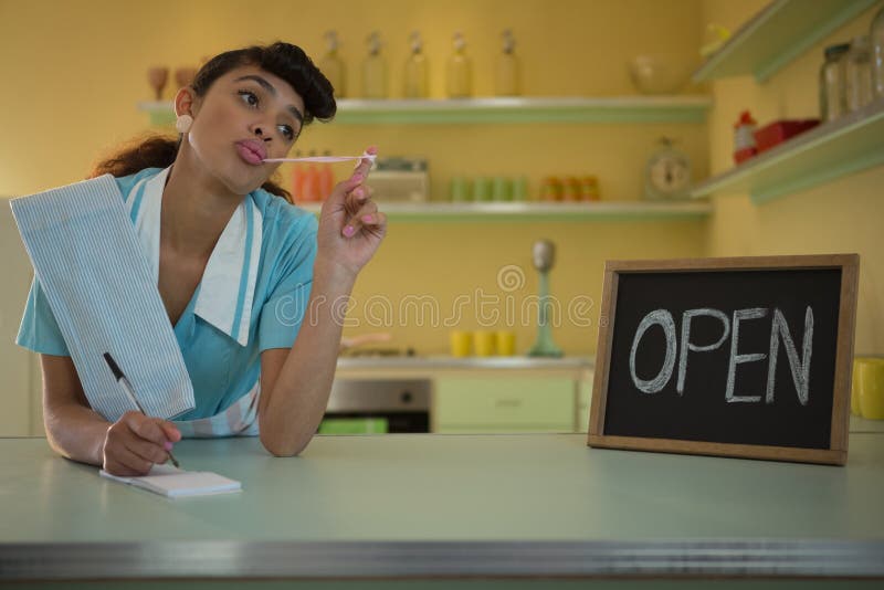 Waitress Standing at Counter in Restaurant Stock Photo - Image of ...