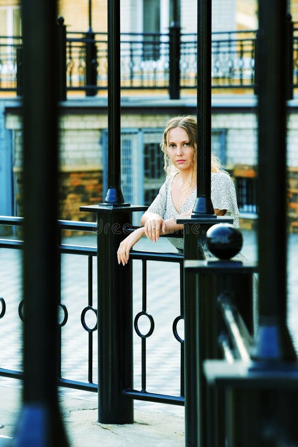 Thoughtful Woman Against a Railing. Stock Image - Image of face, lonely ...