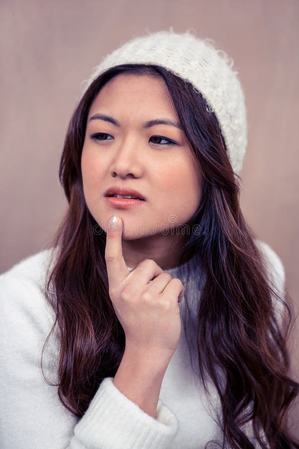 Thoughtful Woman with Finger on Chin Stock Photo - Image of brown ...