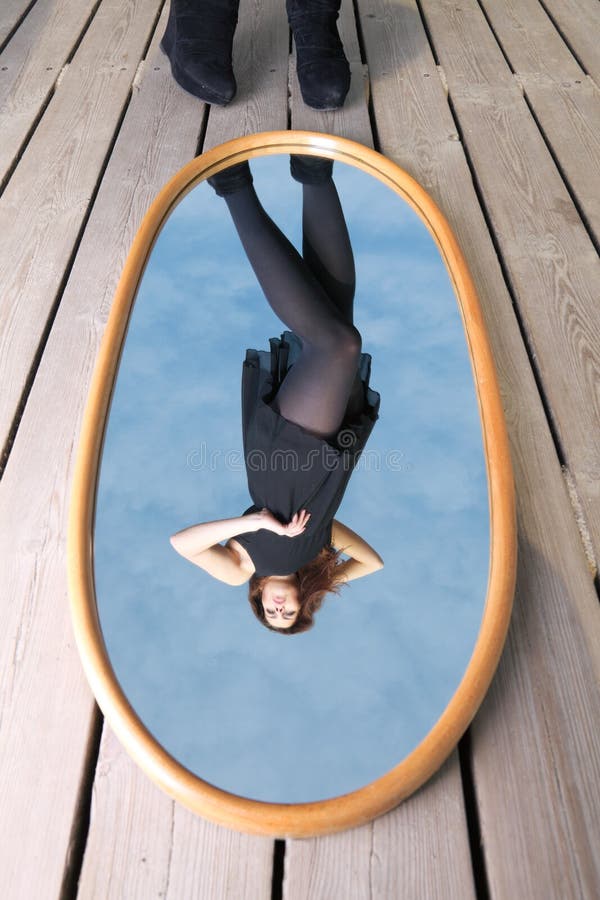 Thoughtful Woman with Her Reflection in Mirror Stock Photo - Image of ...