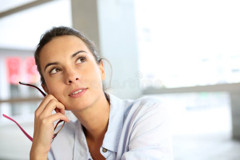 Thoughtful Woman Looking Up Stock Image - Image of university, indoors ...