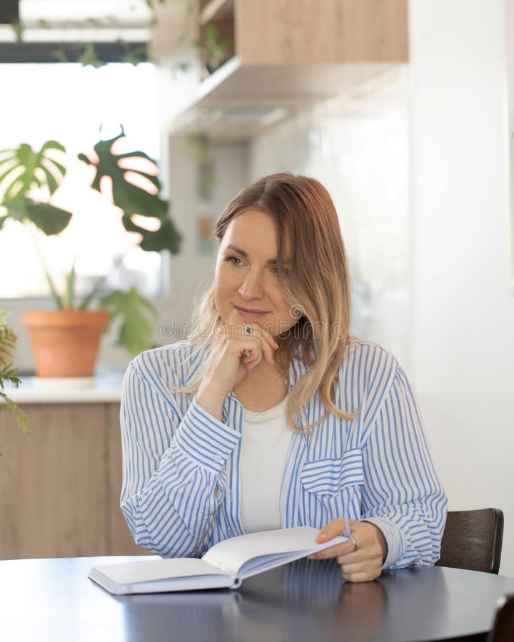 Thoughtful Woman Planning in Modern Kitchen with Plants Stock Image ...