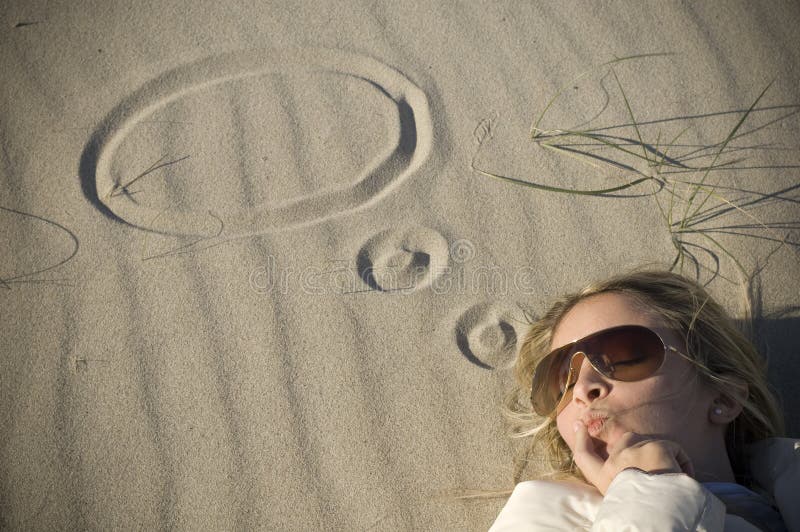 Thoughtful woman on sand stock photo. Image of contemplating - 3827826