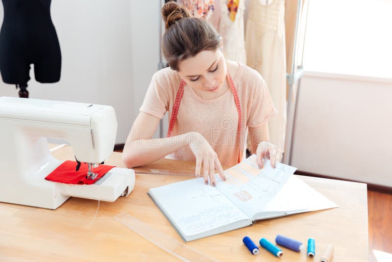 Seamstress Working in Her Studio Sewing Clothes Stock Image - Image of ...