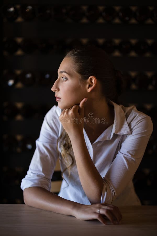 Thoughtful Woman Sitting at Counter Stock Image - Image of counter ...