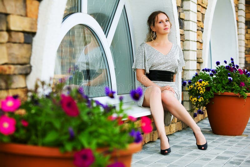 Thoughtful Woman Sitting on the Window. Stock Image - Image of flowers ...