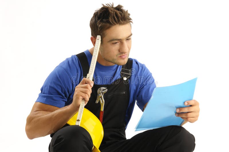 Young Worker Reading Instructions Stock Image - Image of black ...