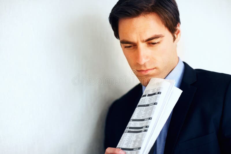 Thoughtful Young Business Executive Holding a Newspaper. Portrait of a ...