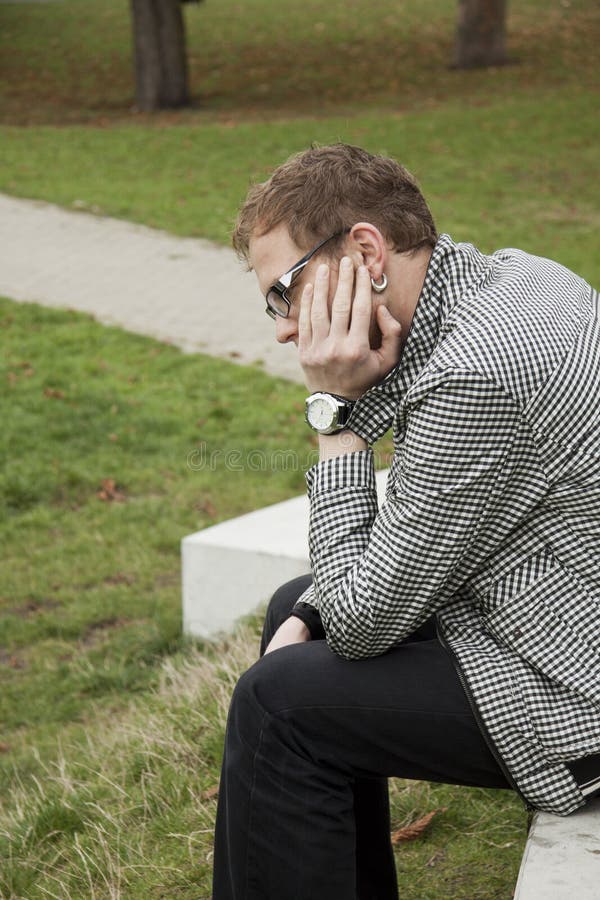 Thoughtful young man stock photo. Image of bench, think - 27570092