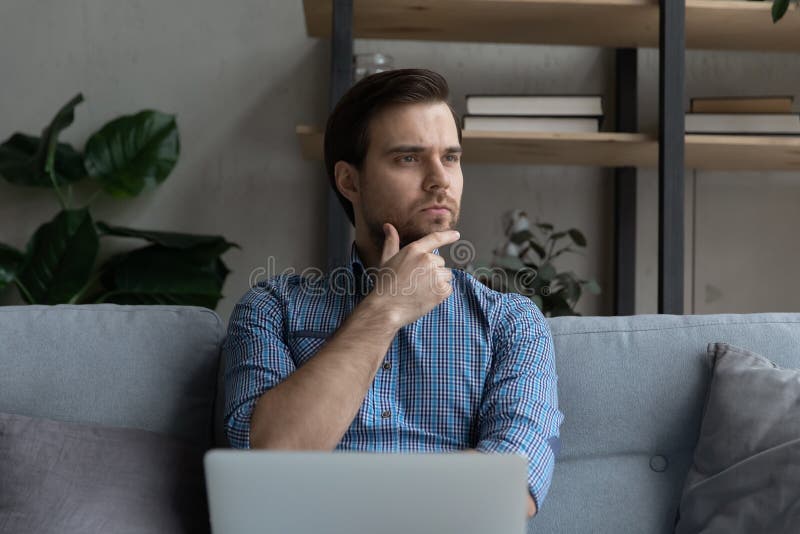 Thoughtful Young Man Considering Problem Solution at Home. Stock Photo ...