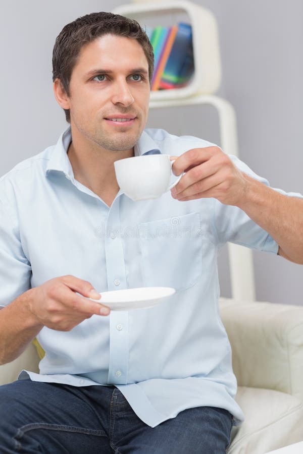 Thoughtful Young Man Drinking Tea at Home Stock Image - Image of ...