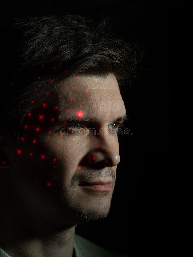 A Thoughtful Young Man Looks To the Right Virtual Interface on His Face ...