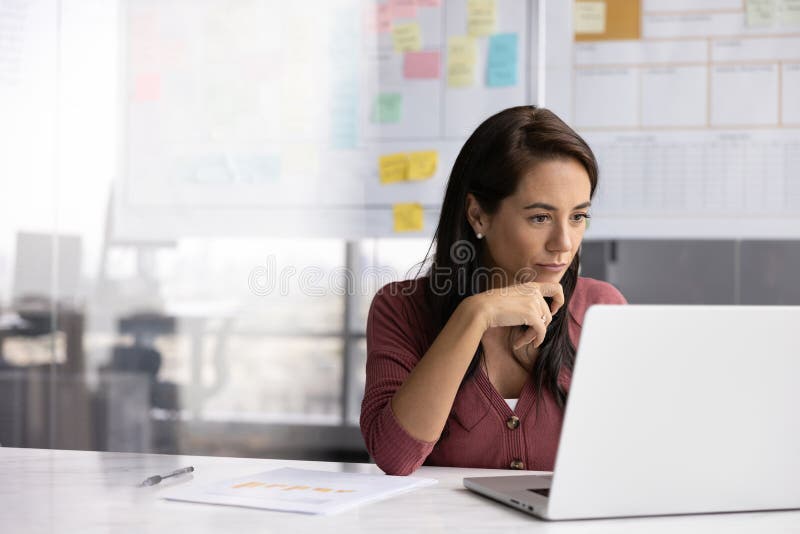 Thoughtful Young Woman Executive Concentrated on Data on Notebook Screen Stock Image - Image of ...