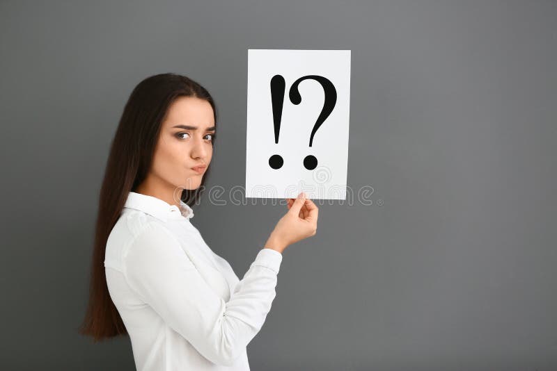 Thoughtful Young Woman Holding Sheet of Paper with Exclamation and ...
