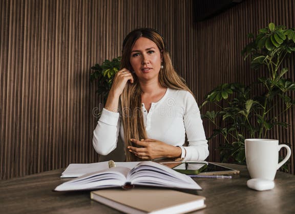 Thoughtful Young Woman Pausing during Her Study Session, Reflecting or Planning Her Next Steps ...