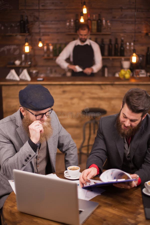 Thoughtfull Businessmen Working in a Coffee Shop Stock Image - Image of ...