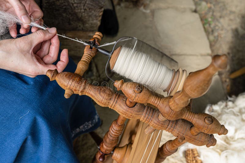 The Thread Maker Makes the Thread on the Spinning Wheel Stock Image ...