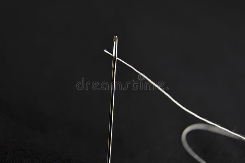 Thread in needle eye stock image. Image of threaded, metallic - 96780385