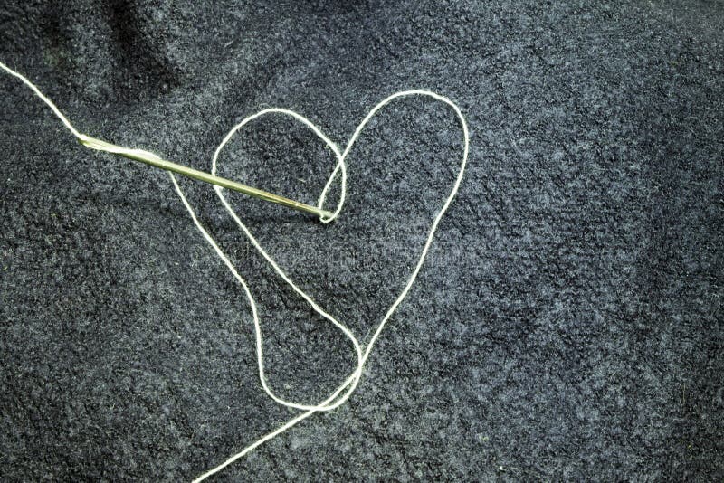 Thread and Needle on a Piece of Matter Stock Photo - Image of design ...