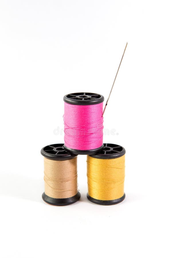 A Spool of Thread and a Needle with a Thread Stock Photo - Image of ...