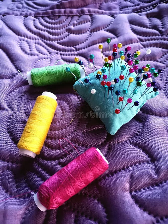 Colored Thread , Pins on a Purple Fabric. Stock Photo - Image of green ...