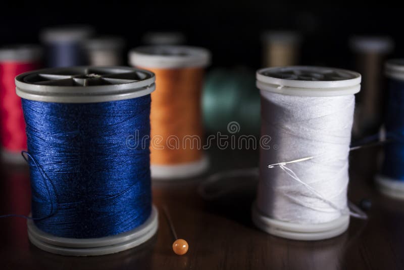 Thread reels on wood table stock image. Image of group - 25373235