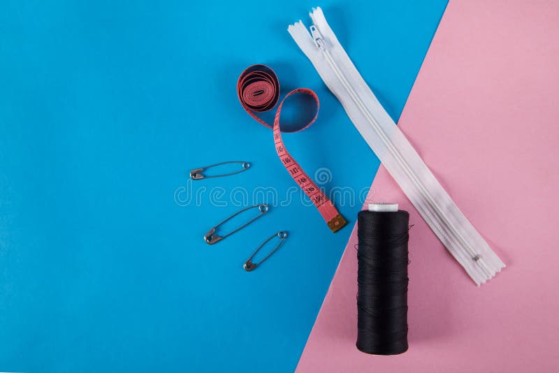 Thread Scissors and Mesure Tape Isolated on Pink and Blue Backgrounds ...