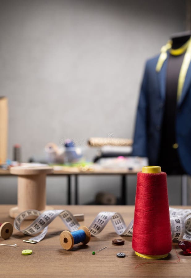 Thread Spool and Tape Measure with Sewing Tools on Table. Concept of ...