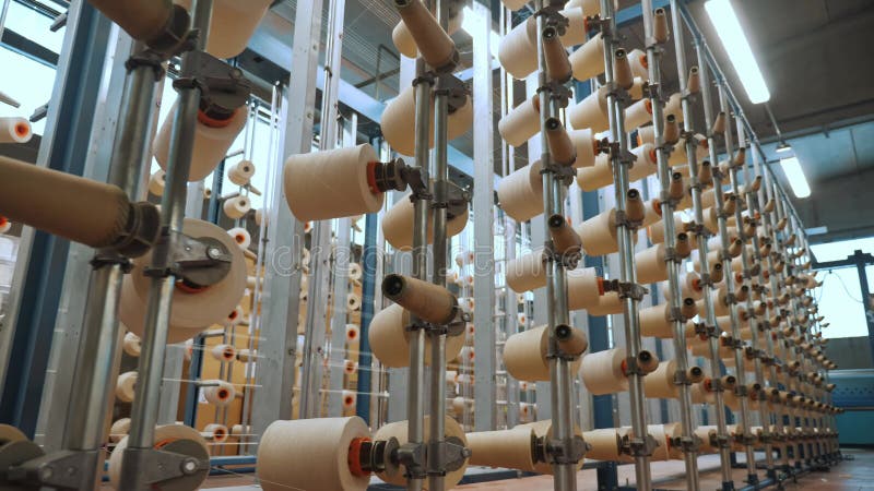 Thread Spools. Textile Industry. Weaving Factory. Racks with Many Thread Spools. Dyeing and ...