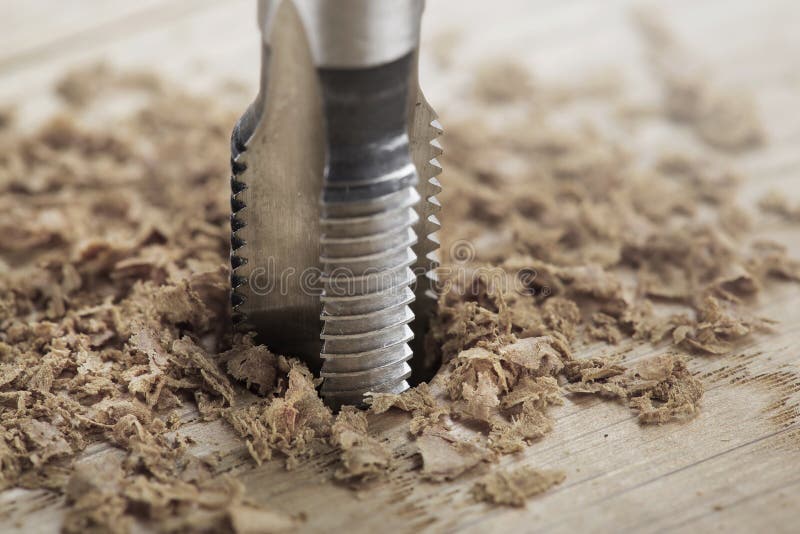 Thread Tap Drill Cutting Hole in Wooden Plate. Working Cutter Stock ...