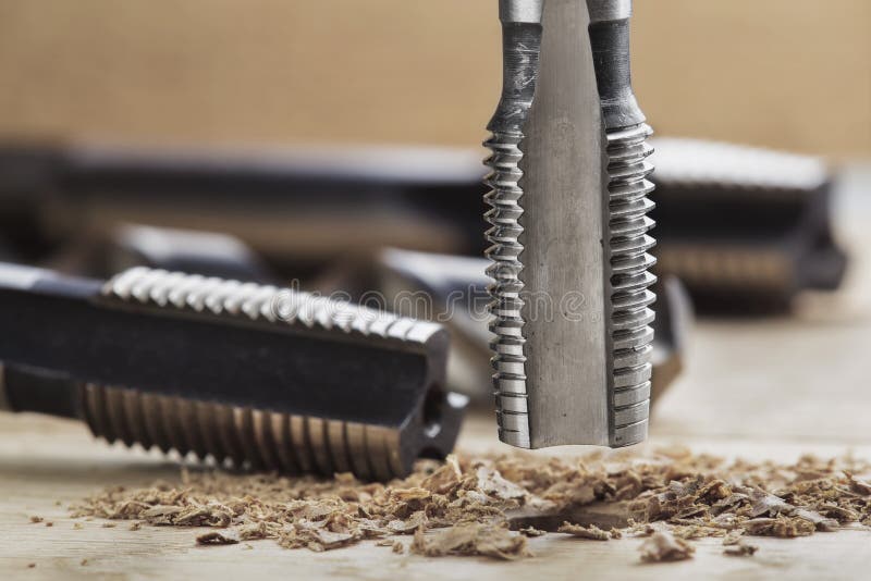 Thread Tap Drill Cutting Hole in Wooden Plate. Working Cutter Stock ...