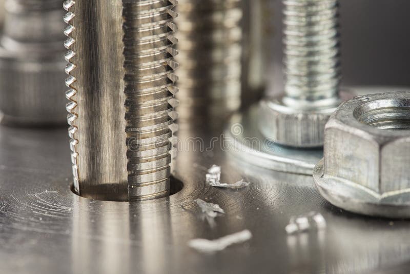 Thread Tap Drill Steel Billet with Drill Bit on Background. Working ...