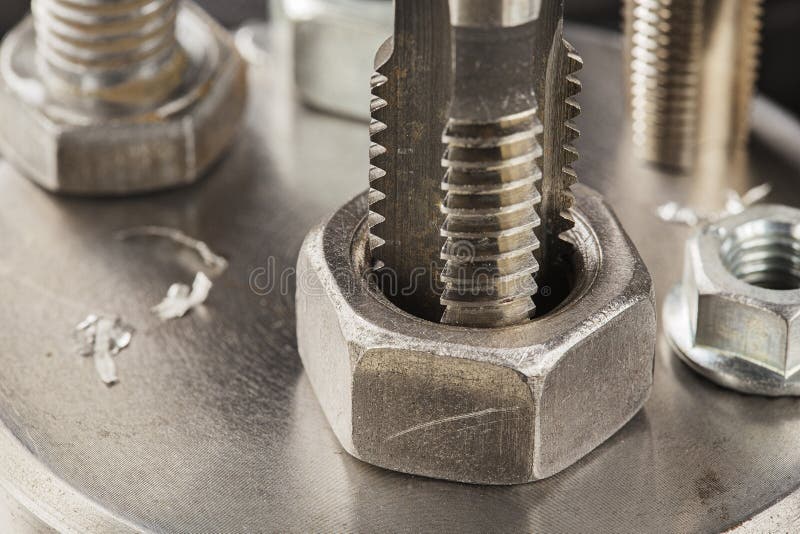 Thread Tap Drill Steel Billet with Drill Bit on Background. Working ...