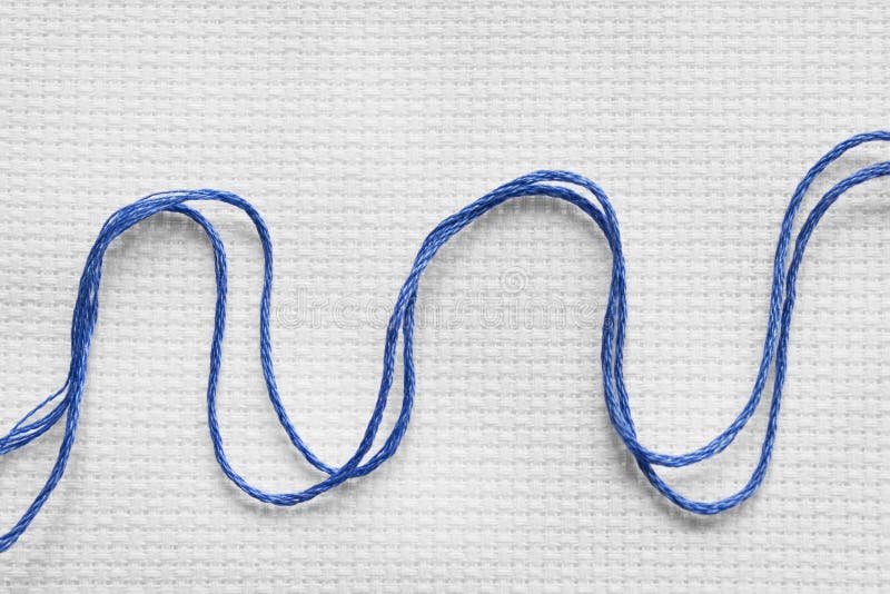 Thread on white canvas stock image. Image of stitching - 113539441