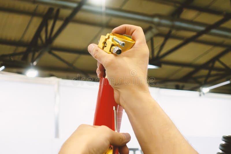 Threaded Clamp Fitting. a Man Screws a Fitting into a Plastic Pipe ...